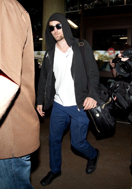 Robert Pattinson has a lot of baggage at LAX