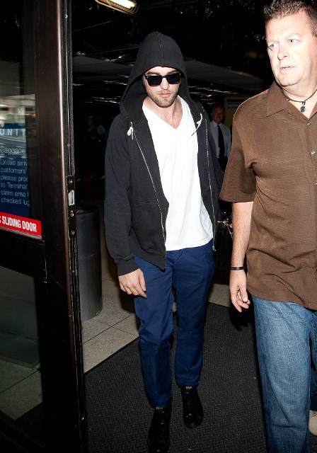 Robert Pattinson has a lot of baggage at LAX