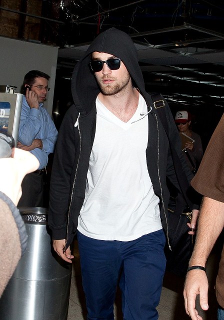 Robert Pattinson has a lot of baggage at LAX