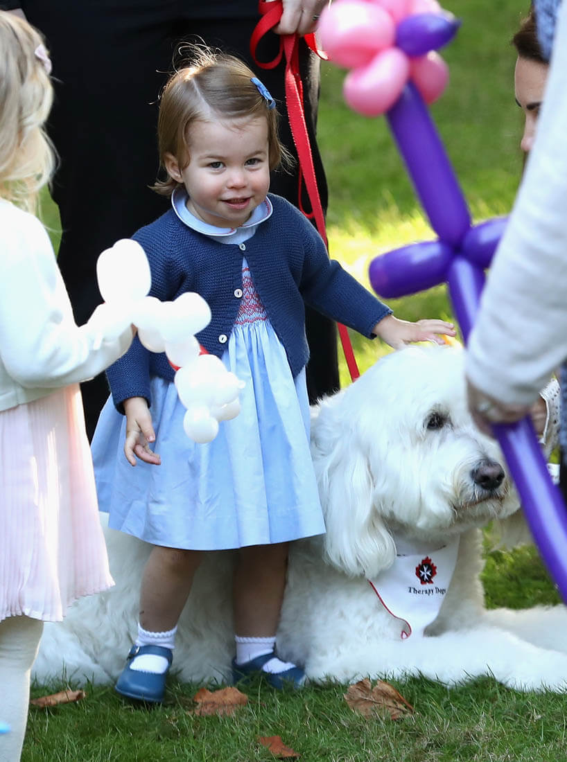 Prince George loves the bubble maker and Princess Charlotte sits on a ...