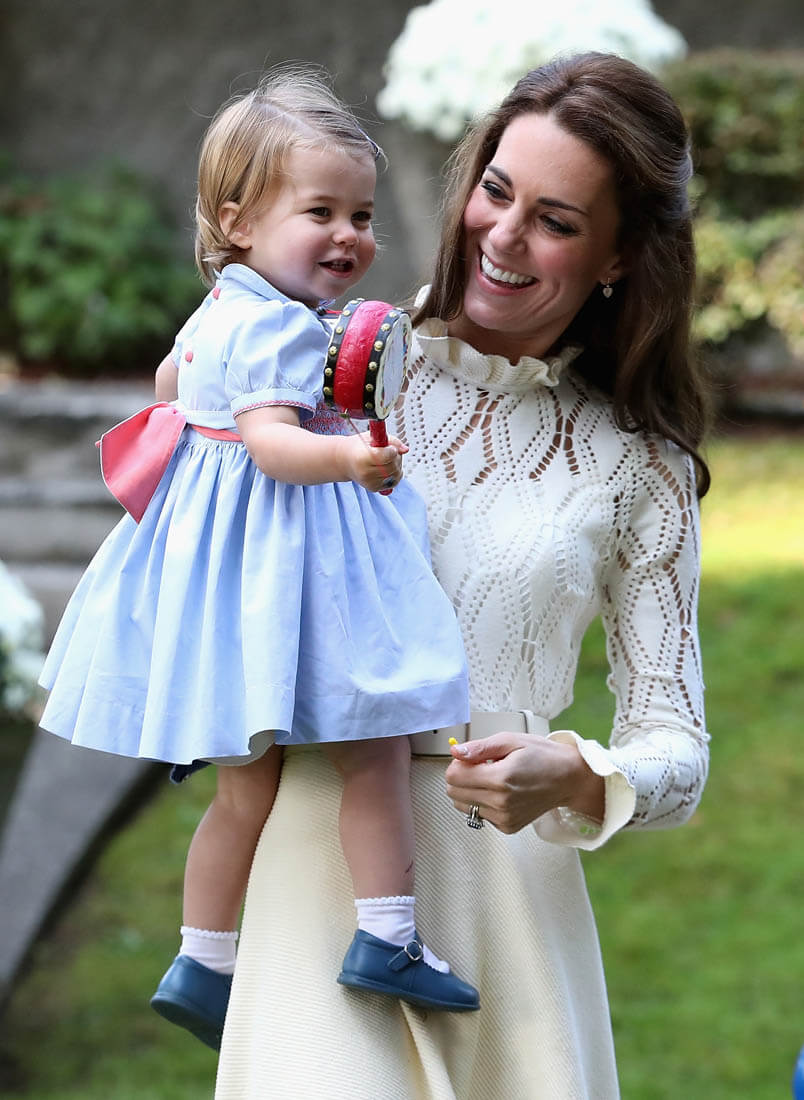 Prince George loves the bubble maker and Princess Charlotte sits on a ...