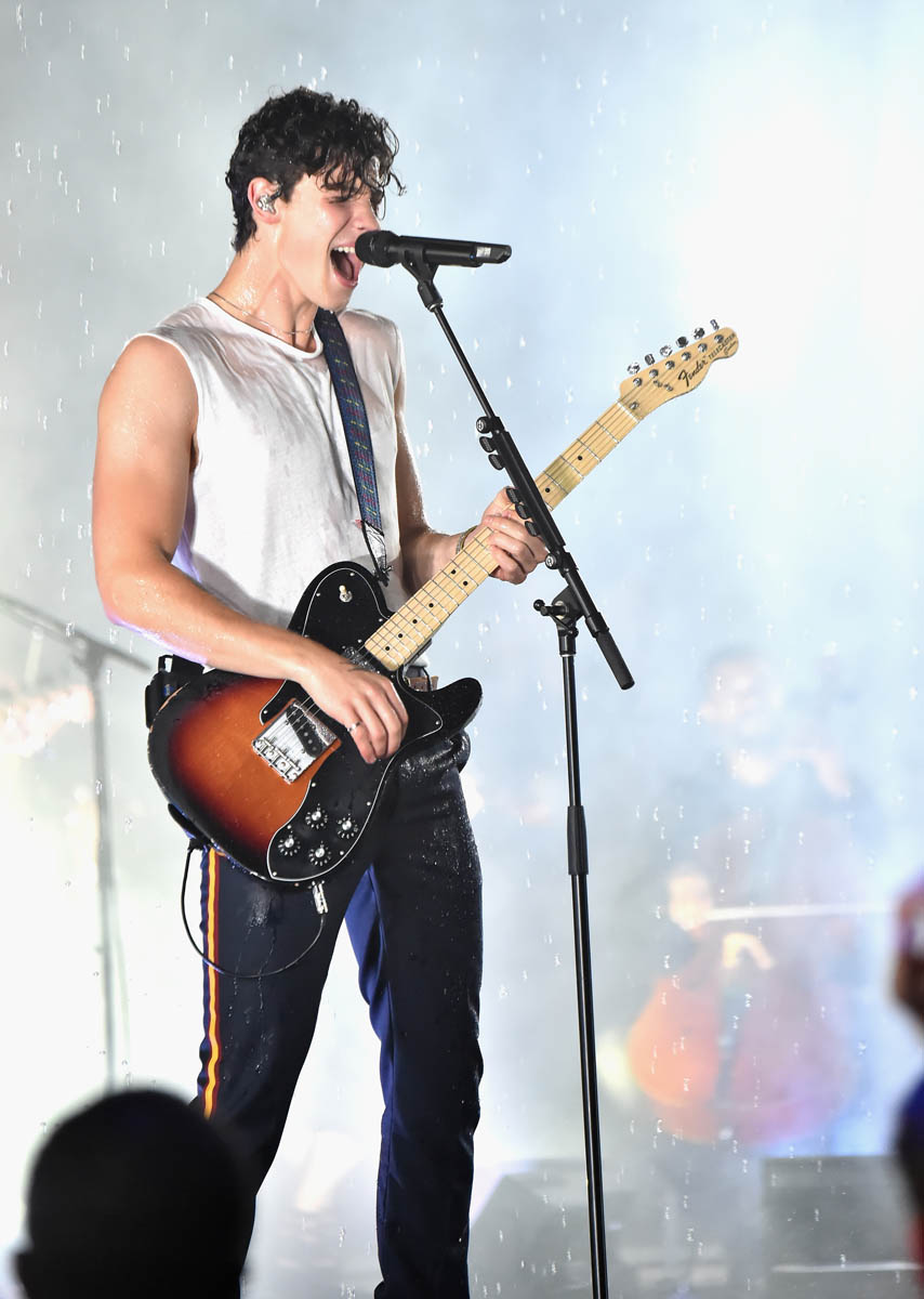 Shawn Mendes performs in the rain during MTV VMAs