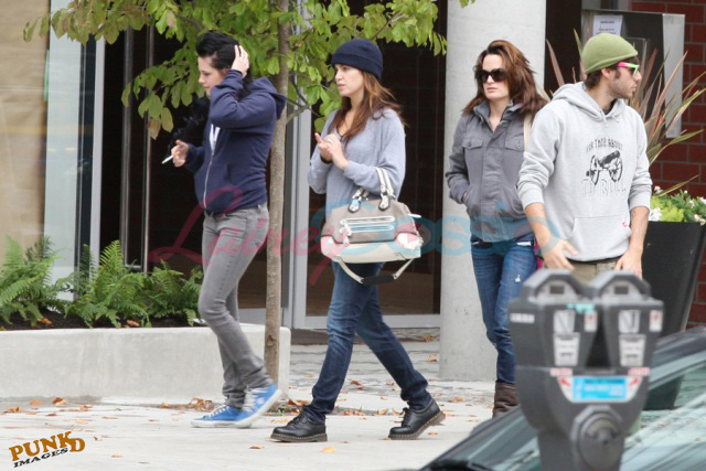 Kristen Stewart wearing red shoes with Nikki Reed Paris Latsis and ...